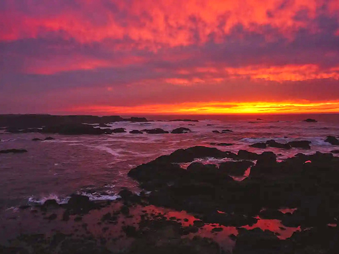 Mother Nature showing off at sunset, painting the Pacific horizon in colors that would make even Bob Ross whisper "happy little clouds."