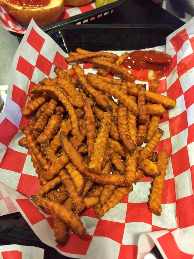 Sweet potato fries – the vegetable that successfully convinced America it could be dessert and appetizer simultaneously – served in their crispy, waffle-cut glory.