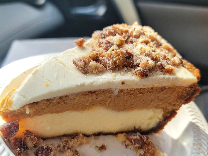 Layers of sweet potato cheesecake goodness topped with what appears to be candied pecans – Southern comfort reimagined as California luxury.