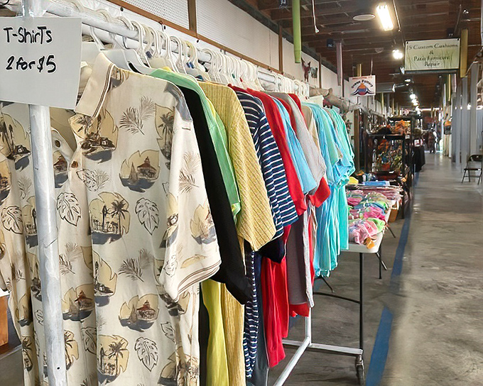 The T-shirt wall—where Florida vacation memories and tropical patterns stand at attention, waiting to transform your wardrobe for the price of a fancy coffee.