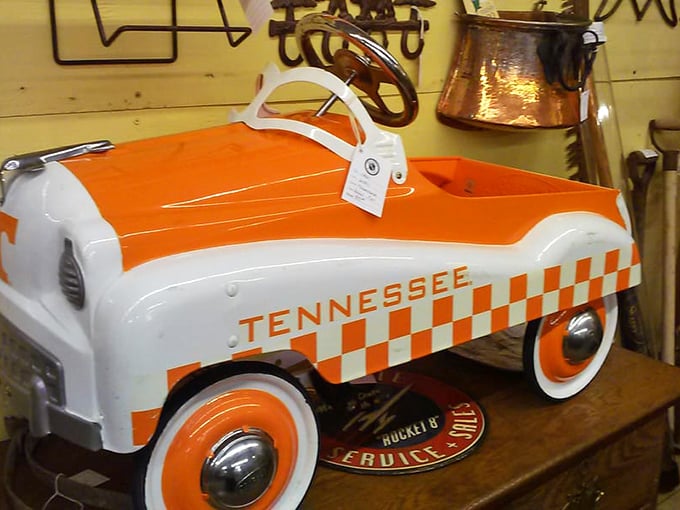 The Tennessee Volunteers pedal car gleams with orange-and-white pride—a childhood dream for little Vols fans from decades past.