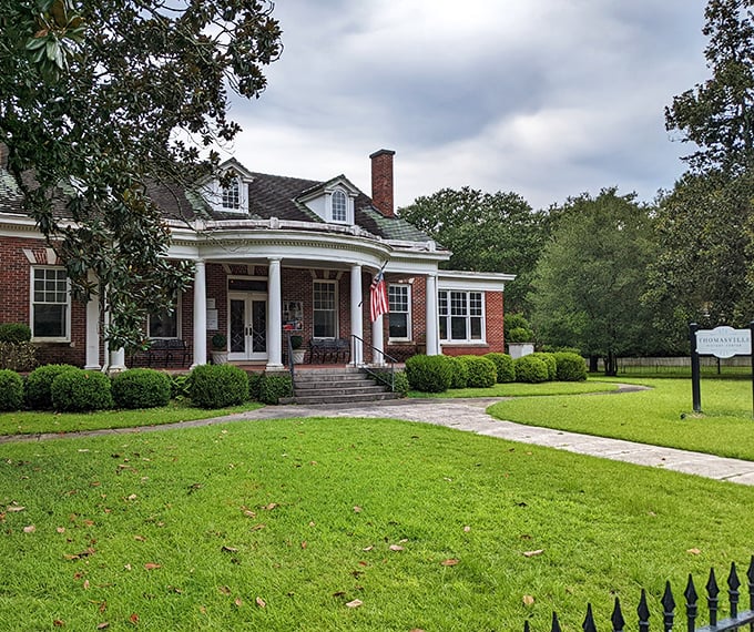 This stately brick mansion with pristine white columns whispers tales of Thomasville's prosperous past while welcoming modern-day history buffs.