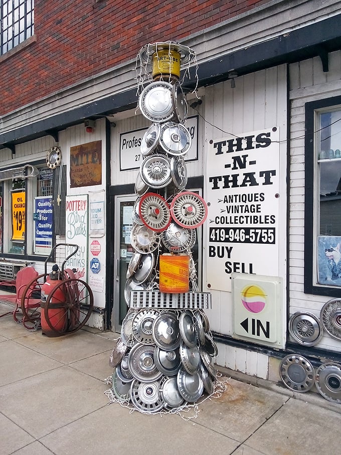 This-N-That Antiques showcases small-town ingenuity with its hubcap Christmas tree—proving one person's junk is another's roadside attraction masterpiece.