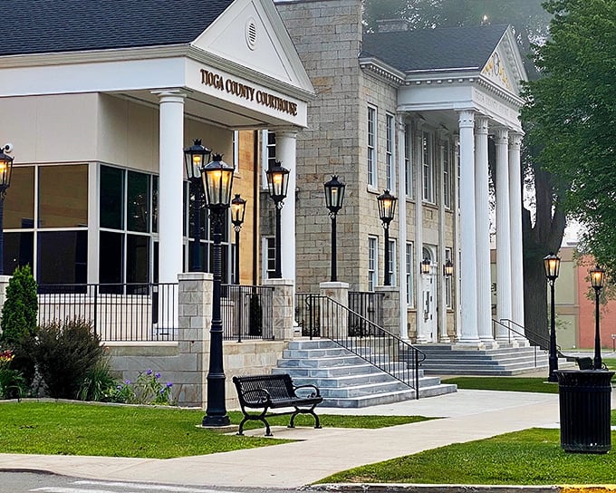 The Tioga County Courthouse stands as an architectural masterpiece, its columns and gas lamps offering a dignified welcome to all.