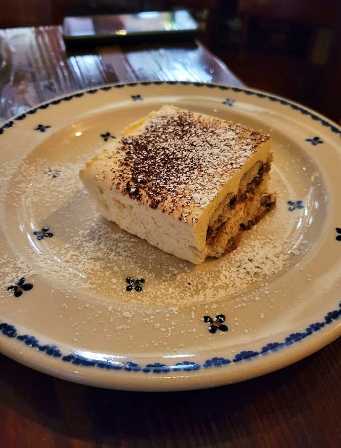 Tiramisu that would make your Italian grandmother weep with joy. Light, ethereal layers of coffee-soaked perfection dusted with cocoa—simplicity at its finest.