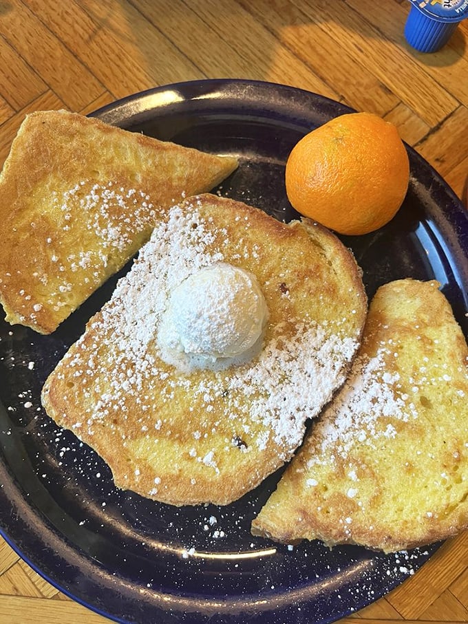 French toast that's actually worth getting out of bed for—golden, crisp edges giving way to custardy centers that make maple syrup feel privileged.