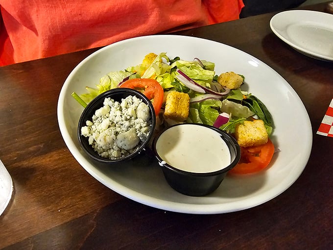 Even the salad gets the royal treatment here. That blue cheese and ranch on the side aren't condiments—they're transformation potions for your greens.