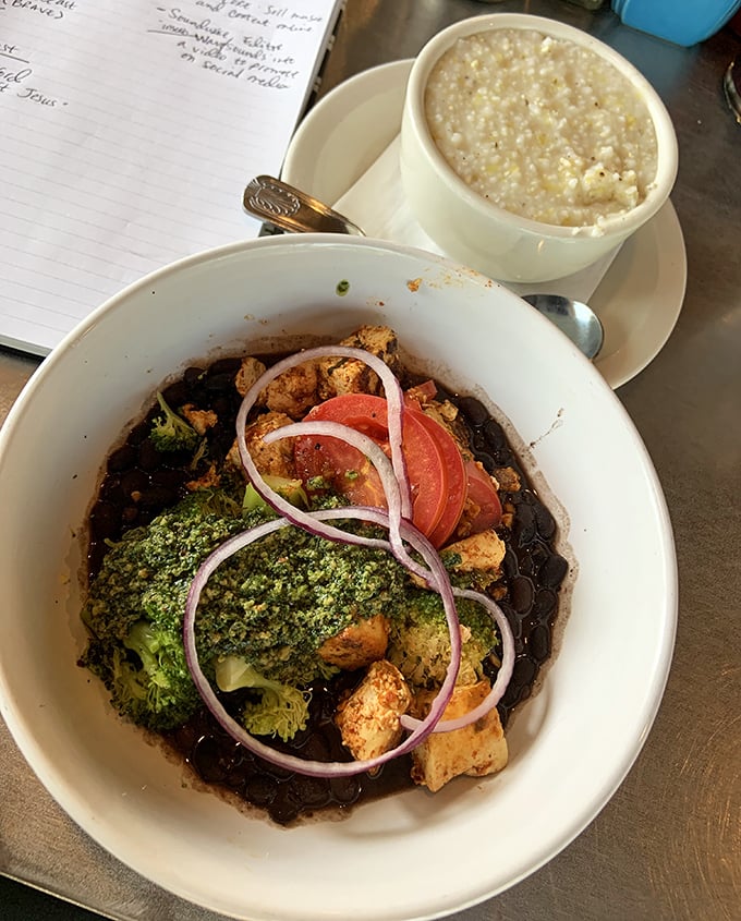 A symphony of textures – hearty grits alongside a vibrant tofu scramble with broccoli and black beans that could convert any carnivore.