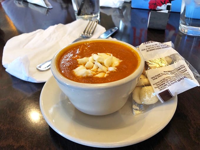 This isn't just tomato soup—it's a bowl of liquid comfort topped with melty cheese islands. Pair it with anything on the menu for instant happiness.