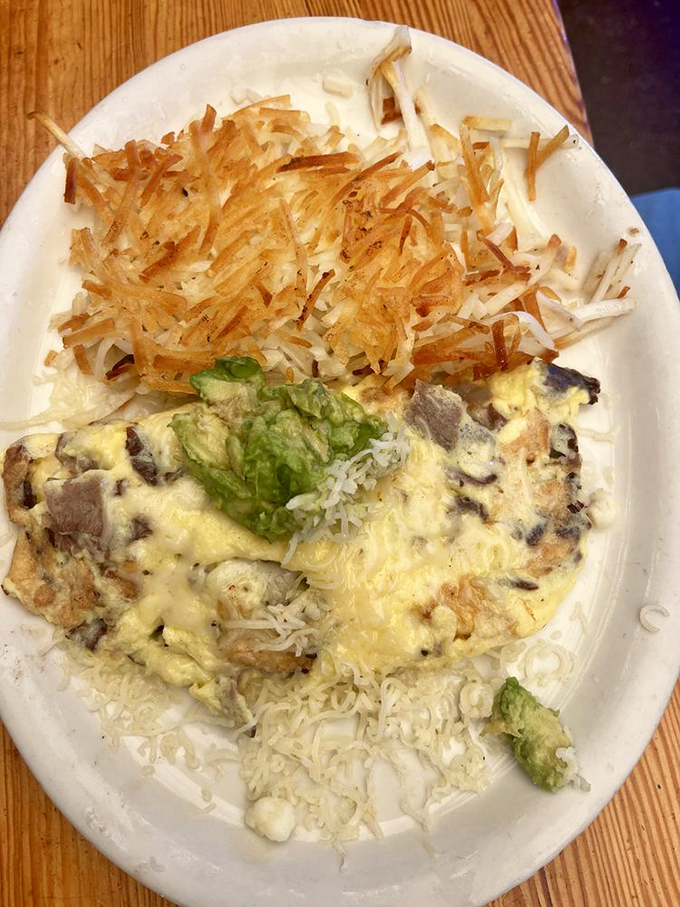 Cheese, avocado, and what looks like perfectly seasoned meat—this omelet doesn't just satisfy hunger, it conquers it with California flair.