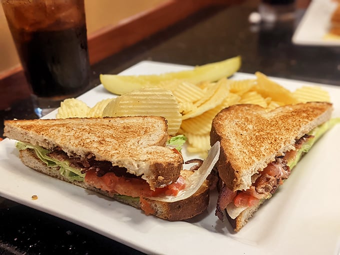 This isn't just a sandwich; it's architecture with mayo – perfectly stacked, precisely cut, and served with the kind of chips that demand to be crunched.