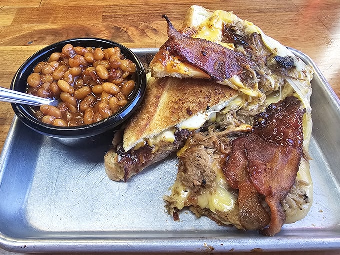 The Ultimate Grilled Cheese isn't messing around – layers of meat, cheese, and Texas toast that would make your cardiologist nervously clear their throat.