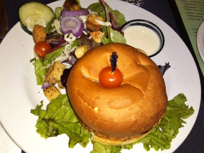 This isn't your sad veggie burger afterthought. Perched proudly on a kaiser bun with fresh fixings, it demands respect from even dedicated carnivores.