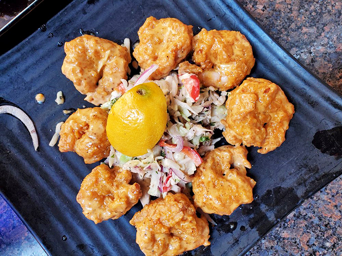 These golden-fried shrimp arranged like a sunburst aren't just food – they're edible art that happens to taste like heaven.