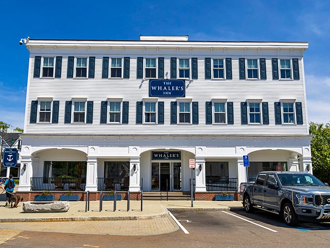 The Whaler's Inn stands as a testament to New England architectural restraint—white clapboard, black shutters, and nautical vibes that whisper "seaside elegance."
