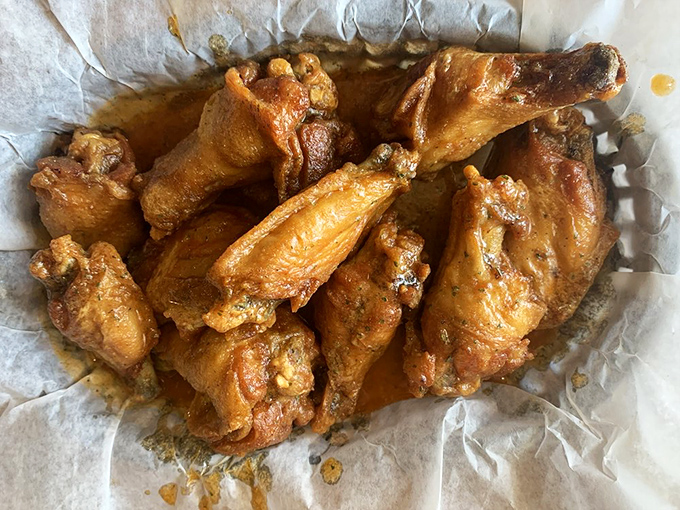 Golden-brown wings that look like they've been taking tanning lessons from Florida retirees—perfectly crisp outside, juicy inside, and ready for dunking.