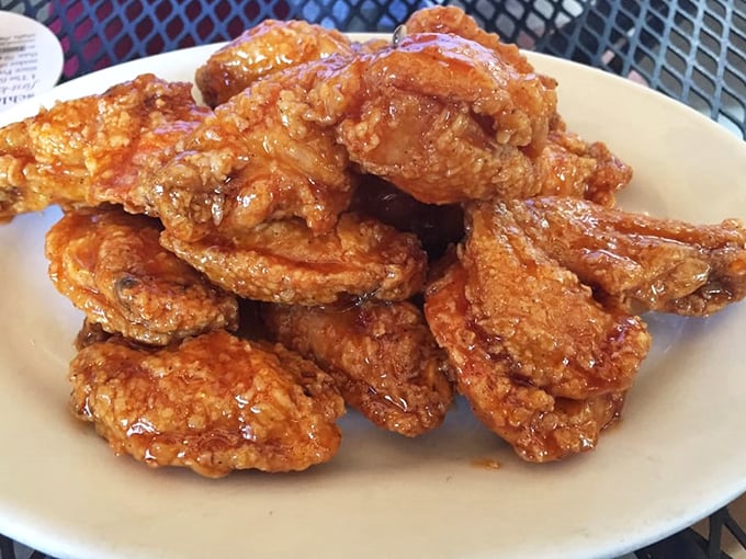Wings that arrive looking like they mean business – crispy, golden, and absolutely unapologetic.