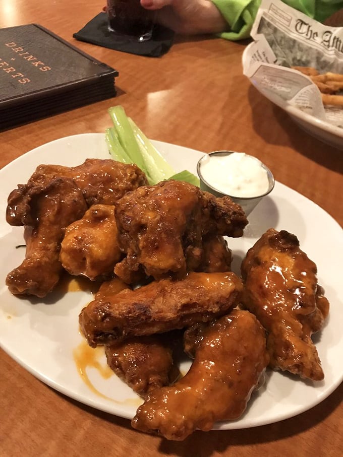 Wings that don't just satisfy hunger but solve problems. Whatever was bothering you before these arrived? Forgotten with the first tangy, sticky bite.