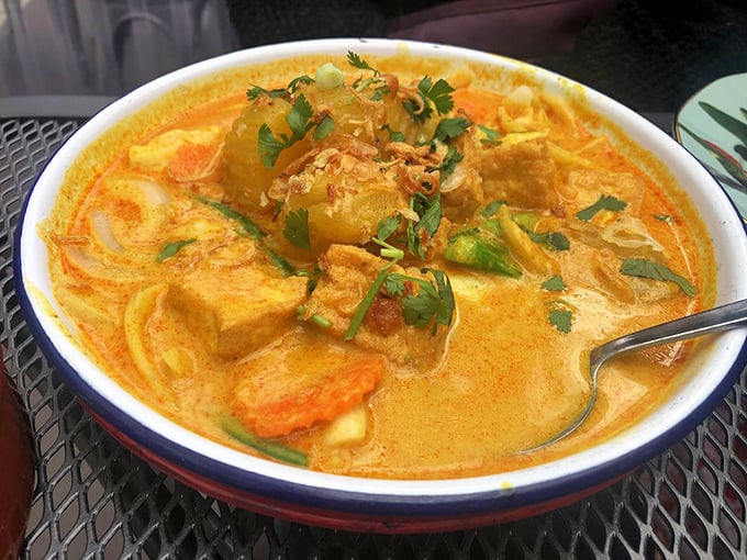 This yellow curry doesn't just sit in the bowl—it beckons, promising comfort and complexity in equal measure, like a warm hug with a surprising twist.