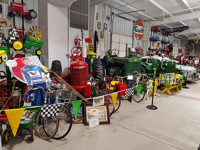 John Deere tractors sharing space with vintage bikes – it's like a mechanical family reunion in here.