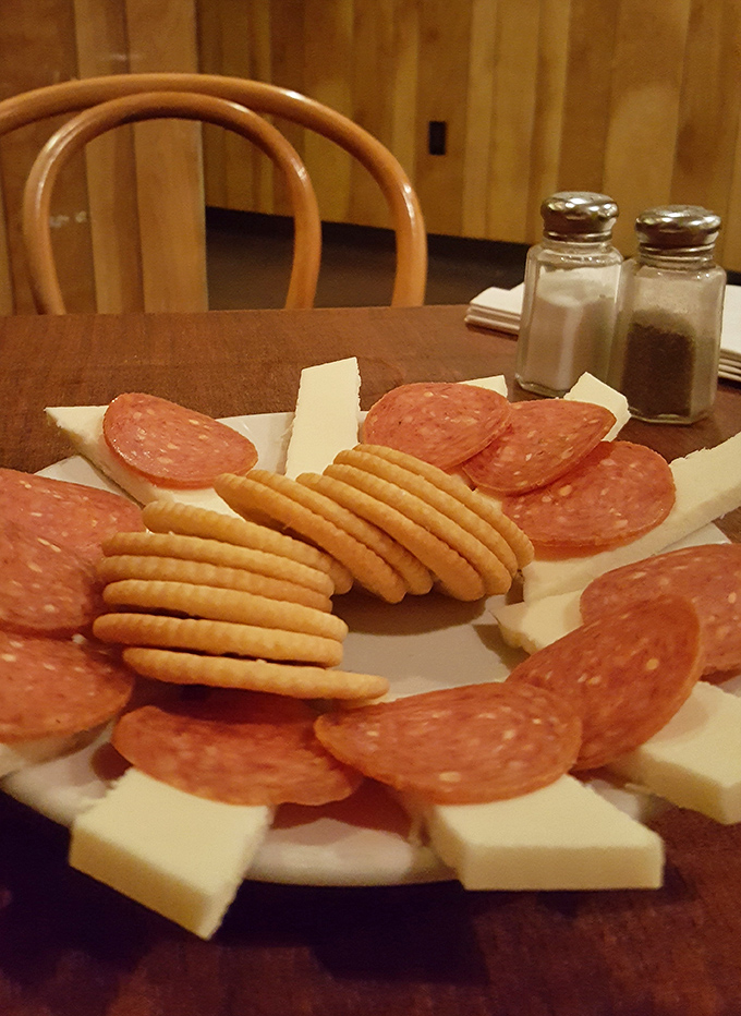 The pepperoni and cheese plate doesn't need to show off—it knows exactly what it is: the perfect companion to cold beer.