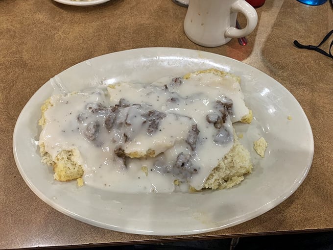 Biscuits and gravy that would make your Southern grandmother nod in approval—a cloud-like biscuit swimming in peppery, sausage-studded heaven.