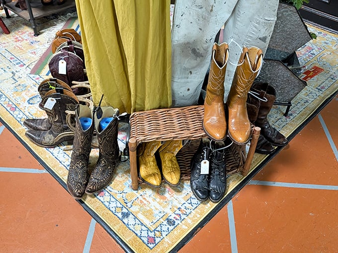 These vintage boots weren't made just for walking—they're strutting their stuff as wearable Texas history on a colorful rug.