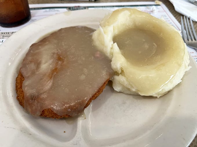 This breaded veal cutlet doesn't just share the plate with mashed potatoes—they're practically in a committed relationship. A marriage of flavors made in comfort food heaven.