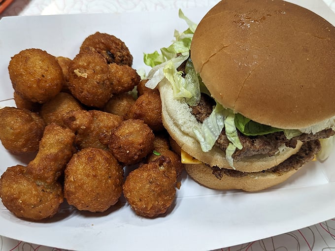 This isn't some fancy gastropub's deconstructed interpretation—it's an honest-to-goodness burger with those magical little mushroom-shaped onion nuggets that deserve their own fan club.