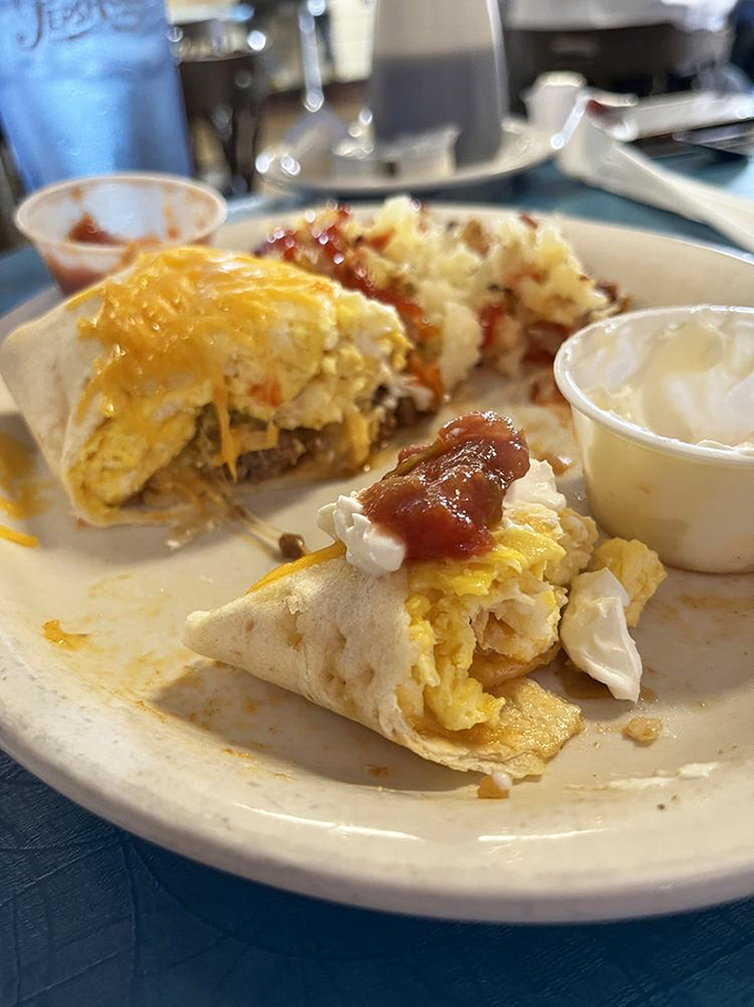 Breakfast burritos done diner-style – eggs, cheese, and salsa wrapped in a tortilla blanket. Morning salvation for under ten bucks.
