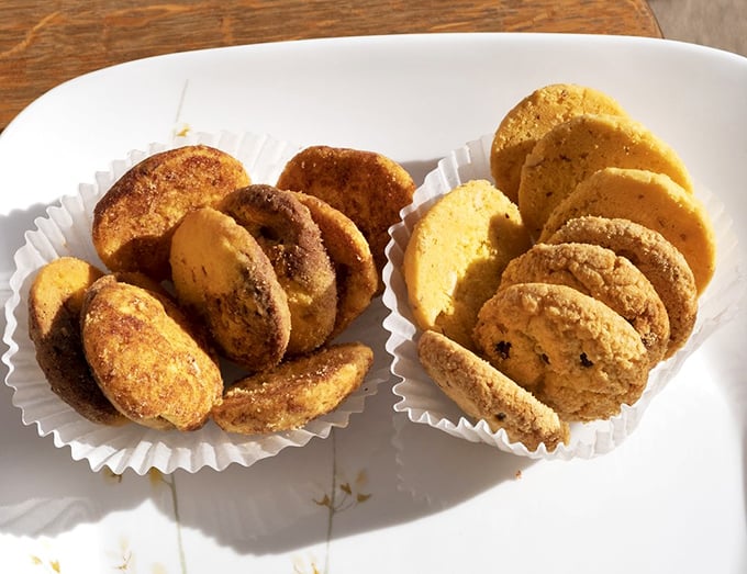 Butter cookies that crumble at first bite, arranged with the precision of a jeweler displaying precious gems rather than sweet treats.
