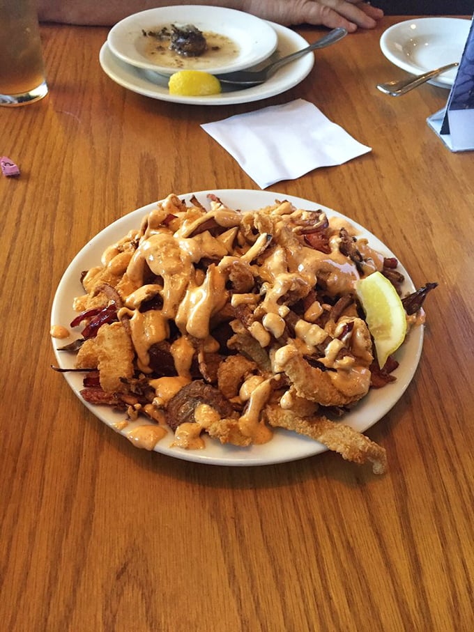 Calamari that defies the rubbery reputation of its lesser cousins—crispy, tender, and generously sauced for maximum finger-licking potential.