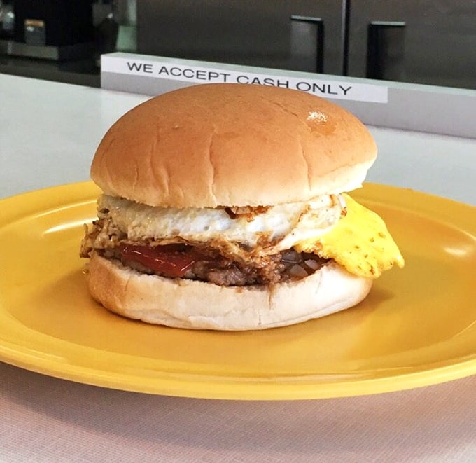 Behold the breakfast sandwich – nature's perfect hangover cure. The egg's sunny disposition might just save your morning.