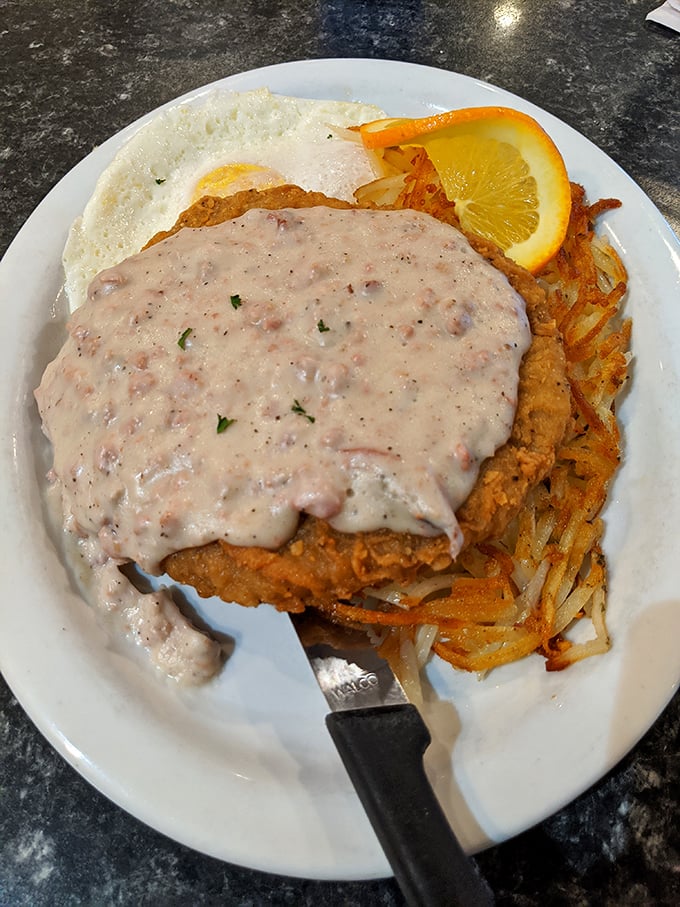 Chicken fried steak swimming in country gravy—a dish that laughs in the face of diets and wins the hearts of comfort food seekers everywhere.