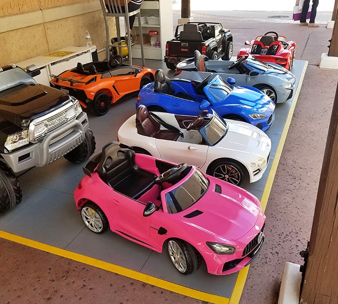 Luxury starts young at the ride-on car display. That pink Mercedes might be the closest some of us get to German engineering this year.