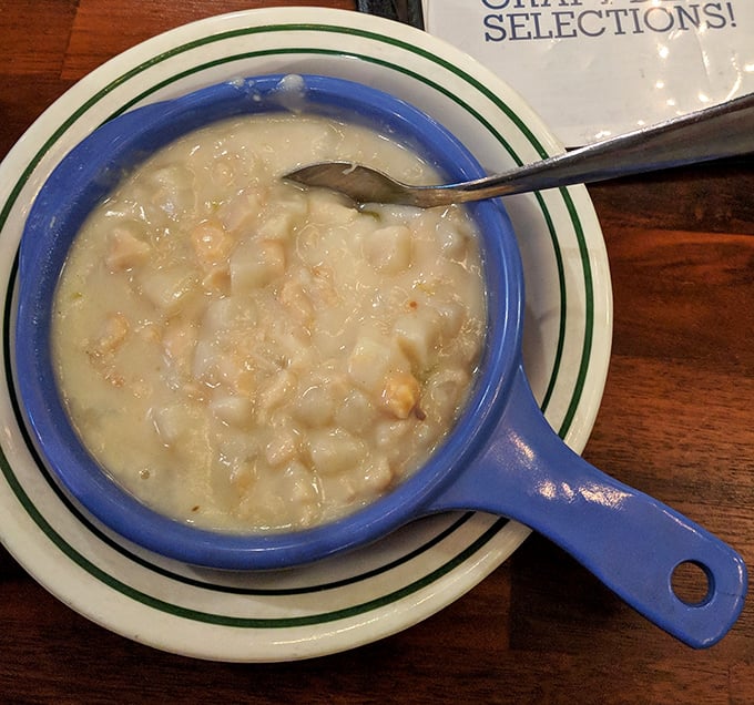 Clam chowder that doesn't mess around—creamy, hearty, and packed with tender morsels. The blue serving dish is just showing off at this point.