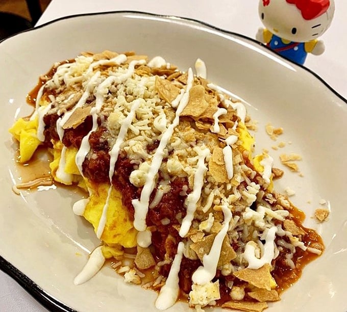 Breakfast reimagined—eggs meet chili, tortilla chips, and a drizzle of sauce in this morning masterpiece that makes alarm clocks worthwhile.