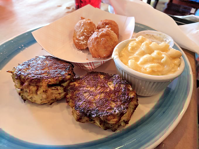 These crab cakes aren't just browned—they're suntanned to perfection. Minimal filler, maximum flavor, and those hush puppies are the backup singers stealing the show.