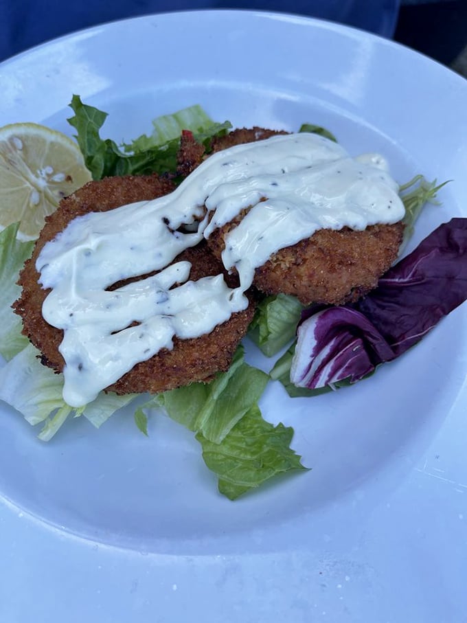 Crab cakes that actually taste like crab—what a concept!—crowned with house-made sauce that complements rather than overwhelms.
