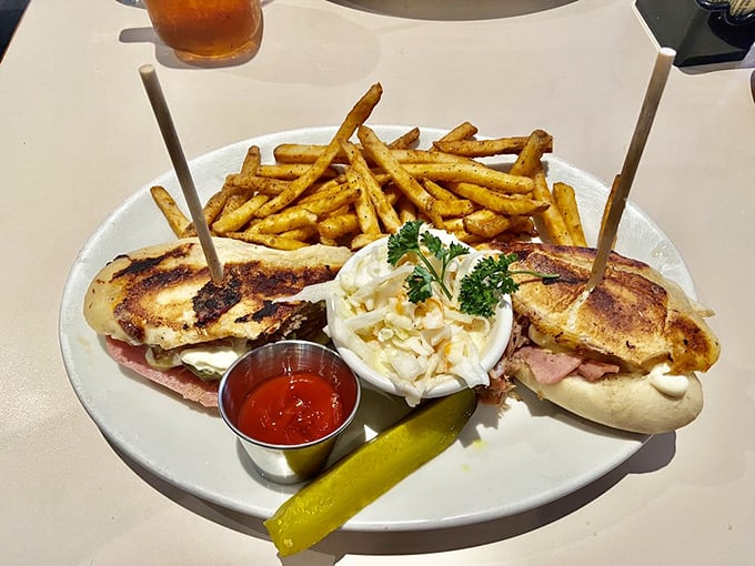 That sandwich looks like it could solve world peace – golden bread hugging what appears to be Cuban sandwich perfection.