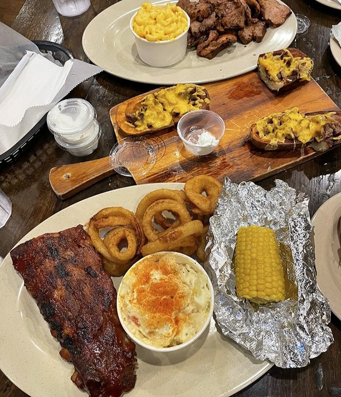 A barbecue spread that would make a vegetarian weep – ribs, mac and cheese, onion rings, and corn on the cob, all on one magnificent plate of smoky excess.