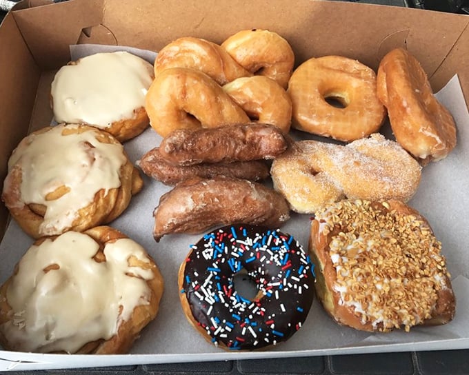 The donut box—a treasure chest containing more joy than should legally fit in cardboard. Diet plans enter at their own risk.