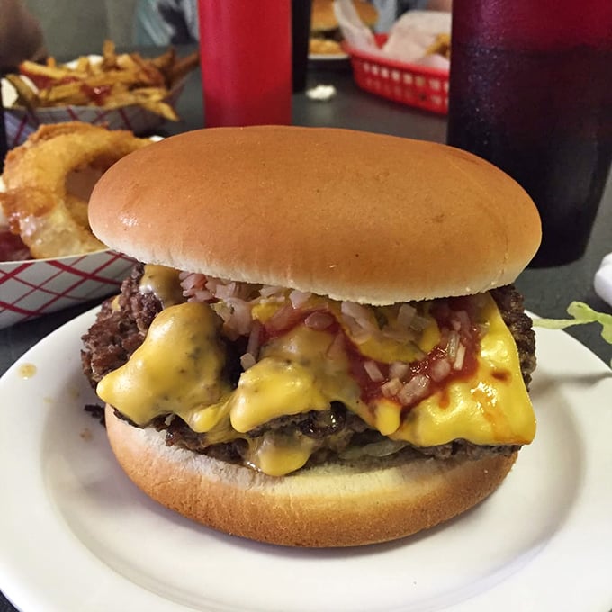 Not all heroes wear capes—some come on a bun with melted cheese cascading down the sides like a yellow waterfall of joy.