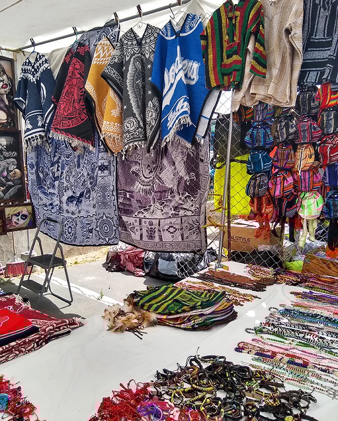 Textile treasures from around the world hang like art installations. These aren't just blankets—they're wearable cultural stories waiting to be told.