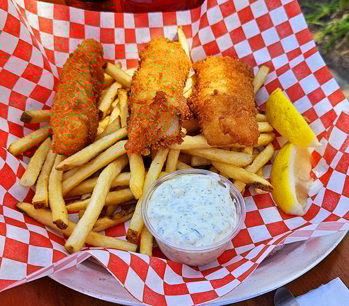 Fish and chips that crackle with each bite, served in a red checkered basket that screams "I'm about to make your day significantly better!"