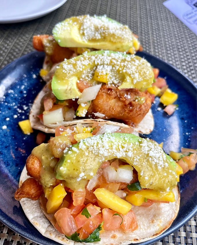These fish tacos aren't just a meal—they're a beach vacation on a plate. Fresh mango salsa and avocado create tropical harmony.
