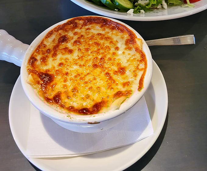 Behold the French onion soup—where cheese stretches to infinity and beyond, creating that Instagram-worthy moment that tastes even better than it looks.