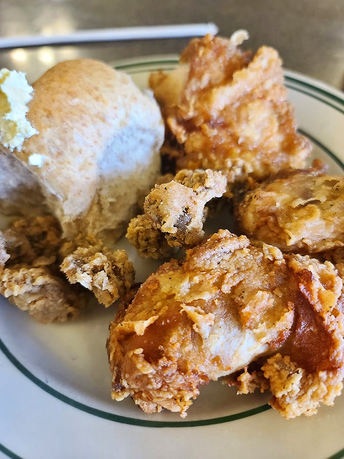 Golden-brown fried chicken with a biscuit sidekick—a duo so perfectly executed it deserves its own Midwestern food hall of fame induction ceremony.