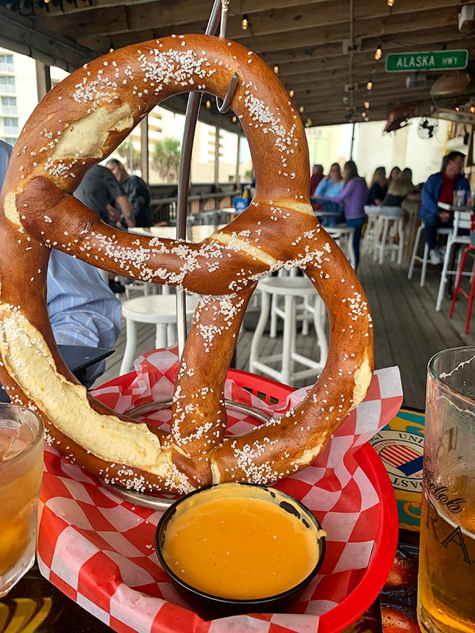 A pretzel so massive it needs its own area code. The beer cheese dip is basically liquid gold for carb enthusiasts.