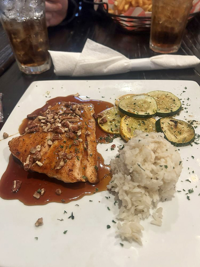 The Bourbon Salmon doesn't just swim upstream—it practically leaps onto your plate with maple-glazed perfection and a pecan crown.
